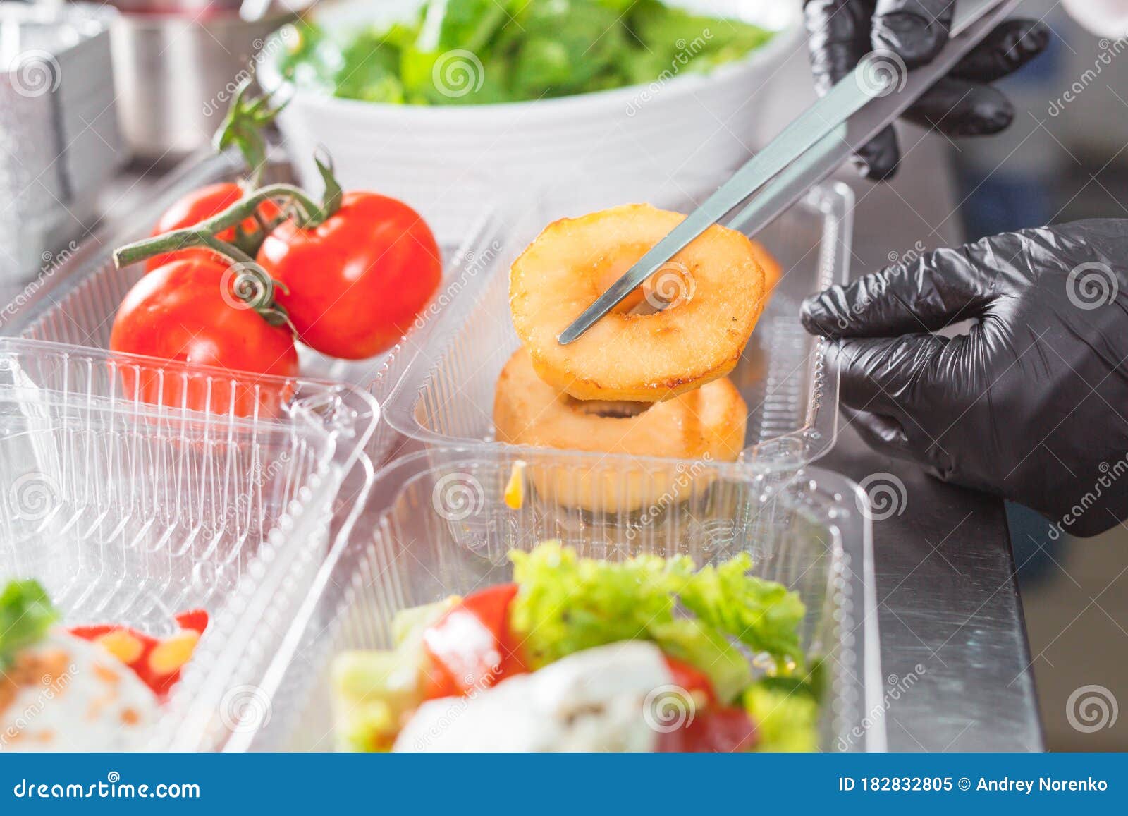 Cooking in a Restaurant and Packing in a Container for Delivery Stock ...