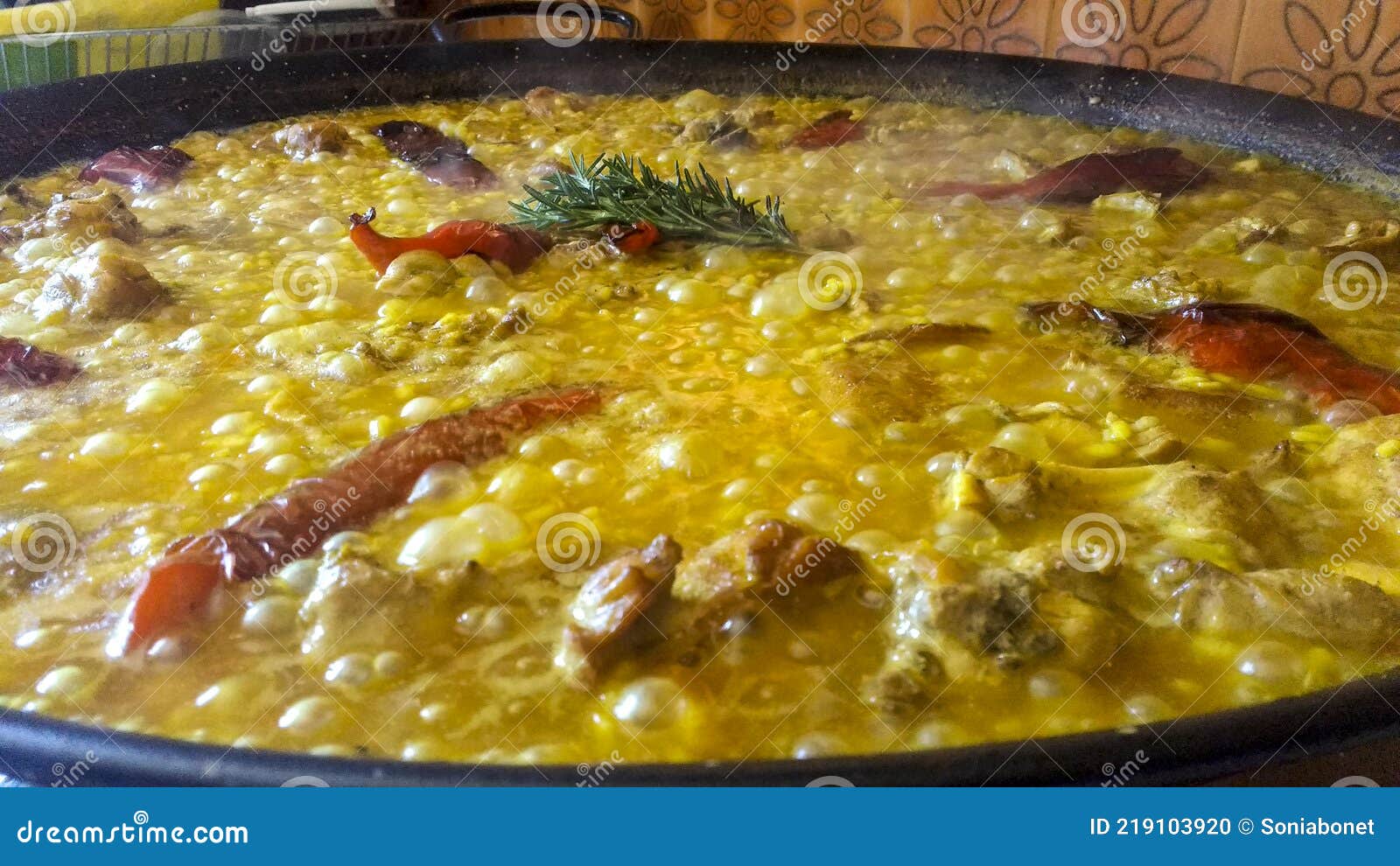 Cooking Delicious Spanish Rice Paella with Rabbit Stock Photo - Image ...