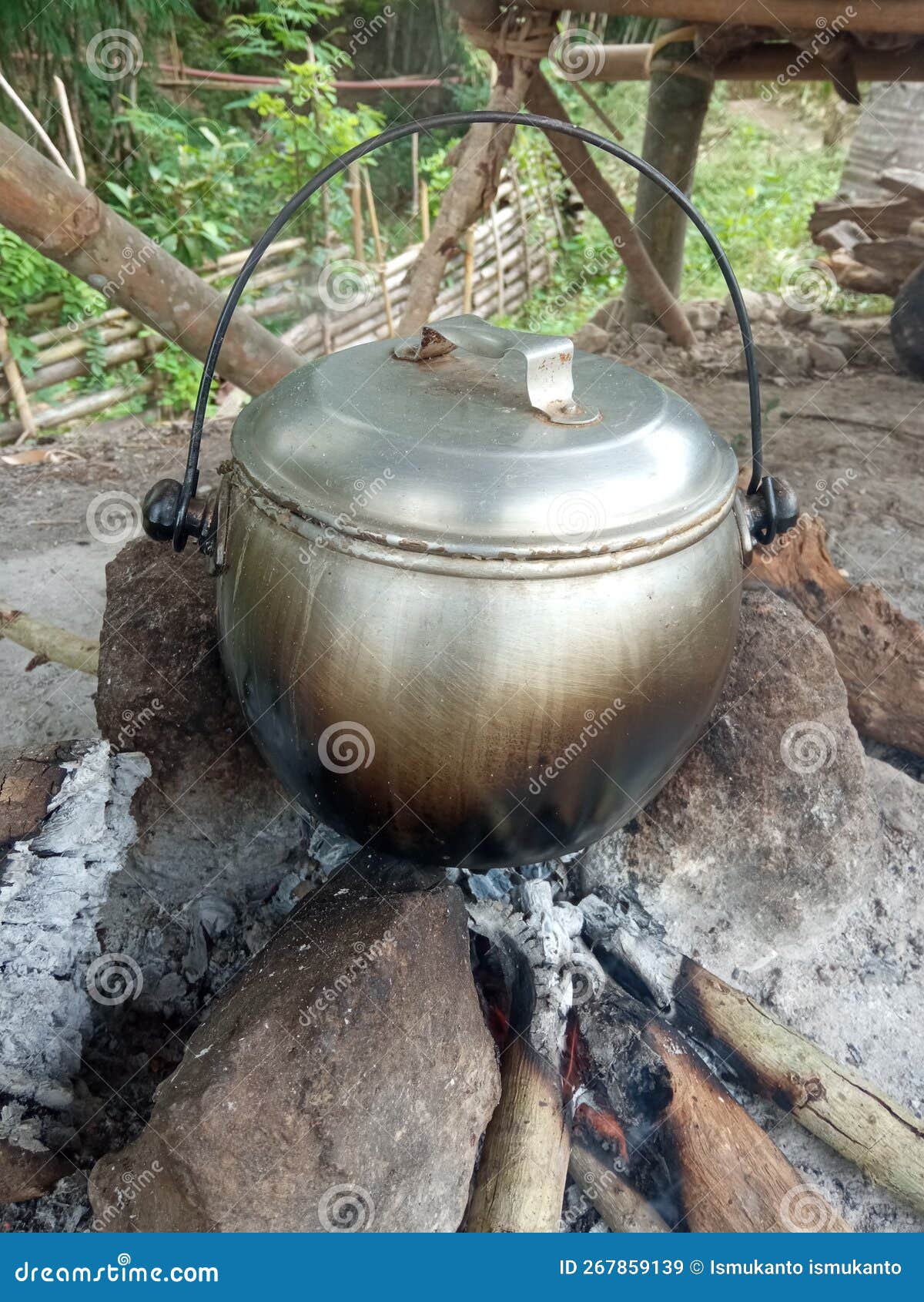 Cooking Rice in the Traditional Way Using a Stone Stove and Firewood ...