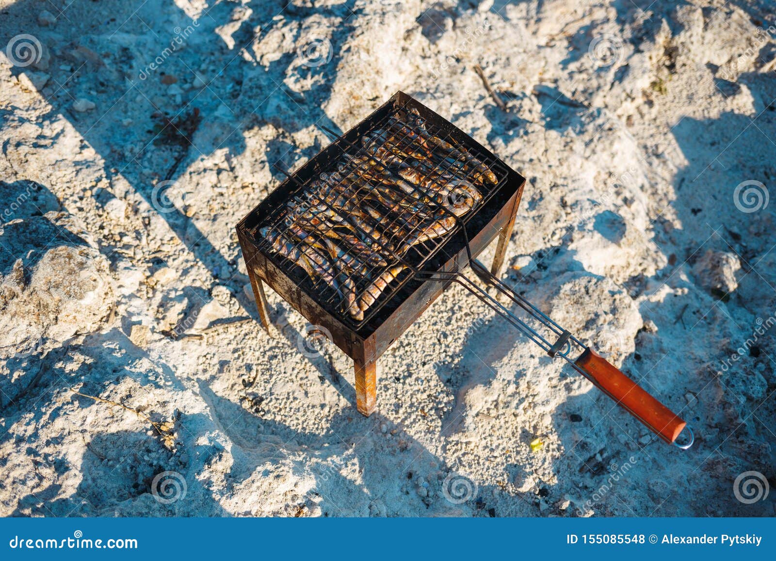 Cooking Small Fish on the Grill on the Beach Stock Photo - Image of ...