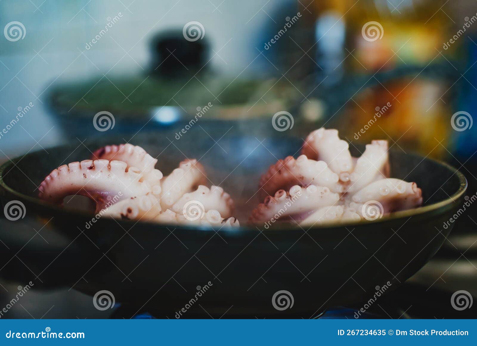 Cooking small octopuses stock image. Image of delicatessen - 267234635