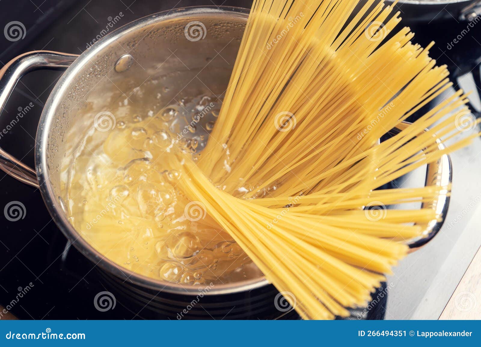 Cooking Spaghetti in a pan stock image. Image of pasta - 266494351