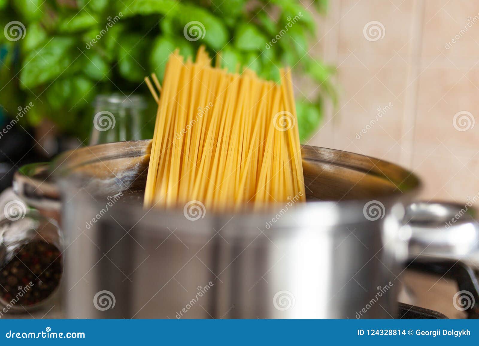 Cooking spaghetti in a pot stock photo. Image of ingredient - 124328814