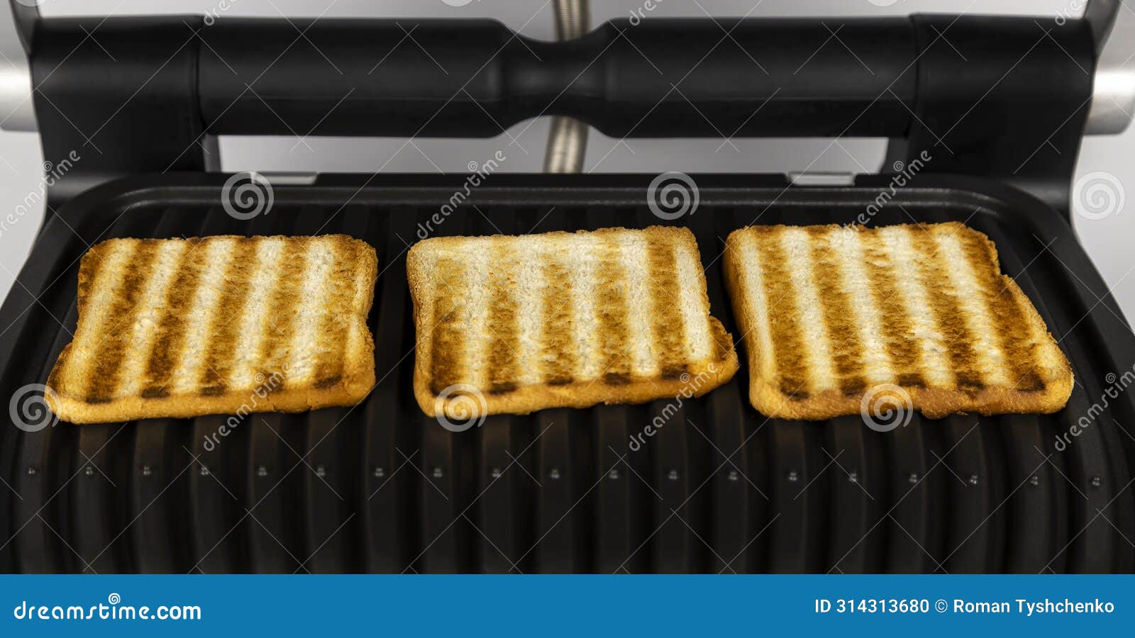 Cooking Toasted Bread on an Electric Grill. Toast Bread Concept. Stock ...