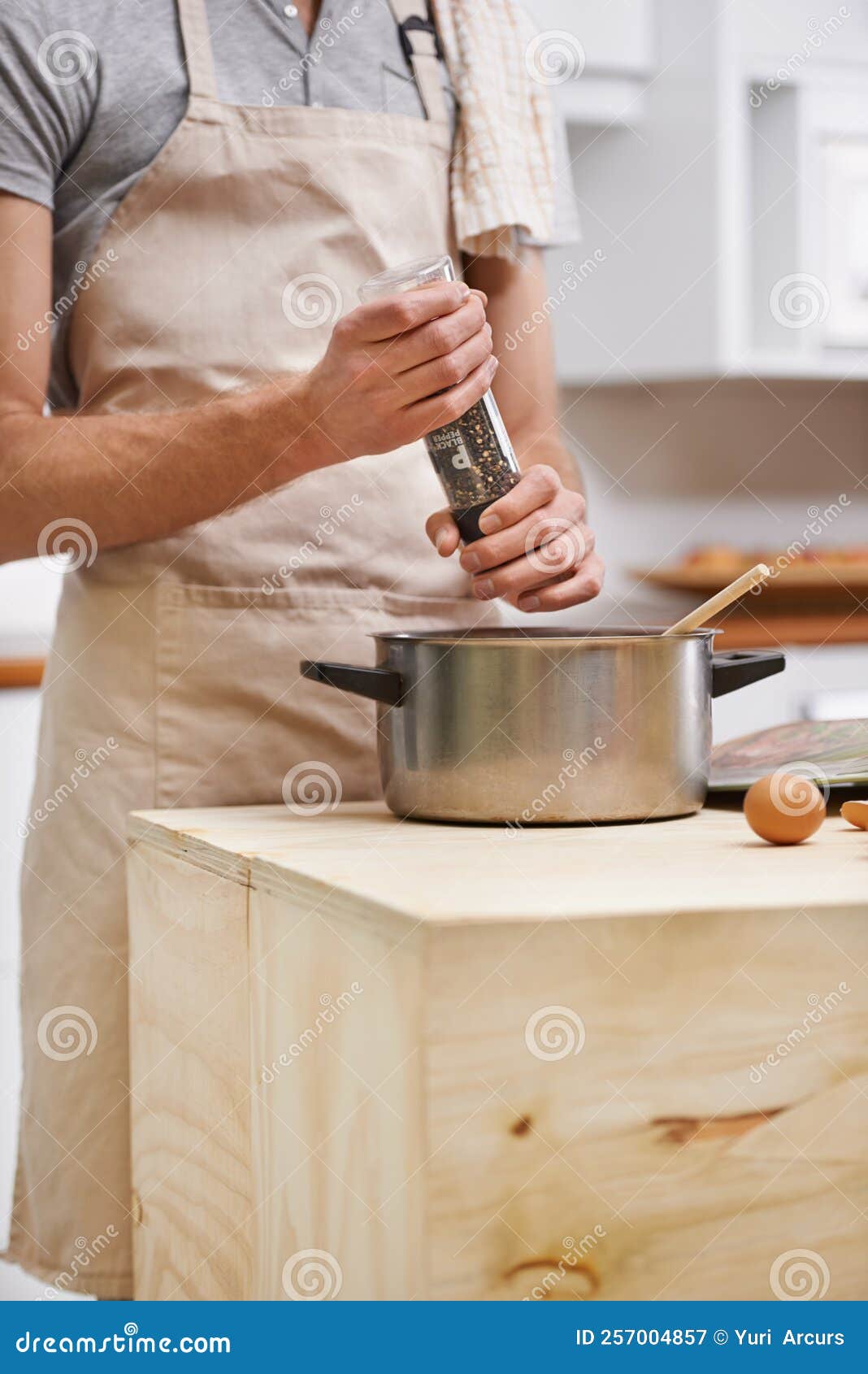 Cooking Up a Storm in the Kitchen. a Young Man Cooking in the Kitchen ...