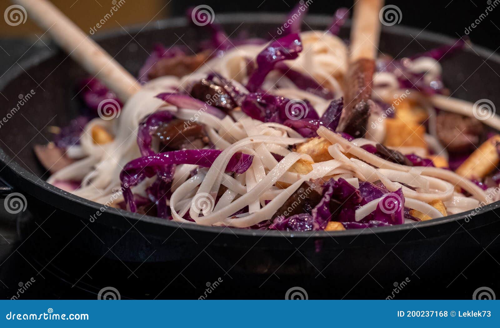 Cooking A Vegan Asian Pad Thai Stir Fry With Red Cabbage Tofu And