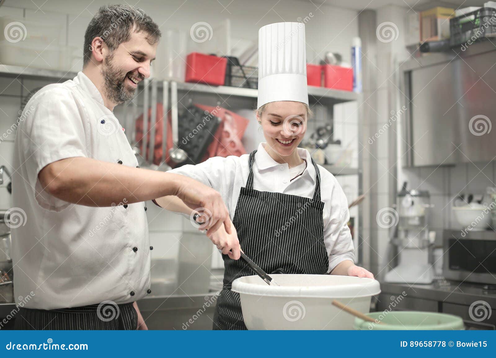 Cooks preparing a meal stock photo. Image of caucasian - 89658778