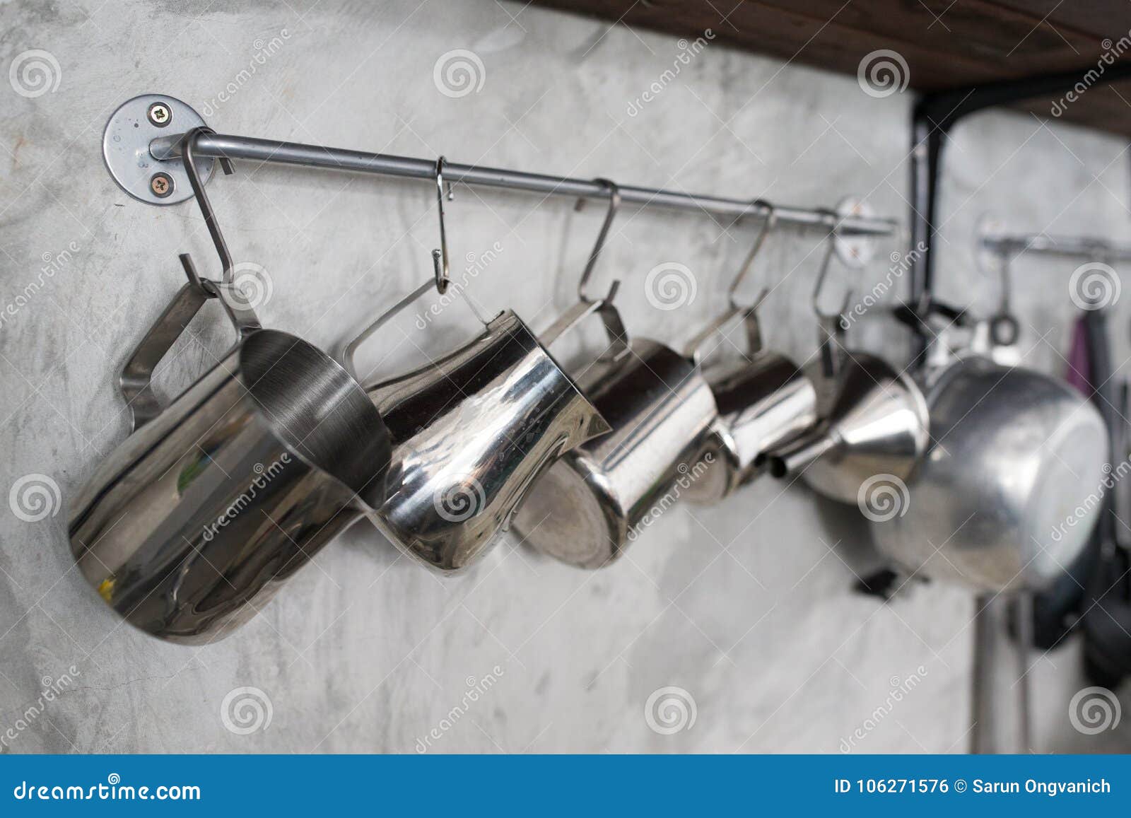 Cookware Hanging in a Kitchen Stock Photo - Image of plate, objects ...