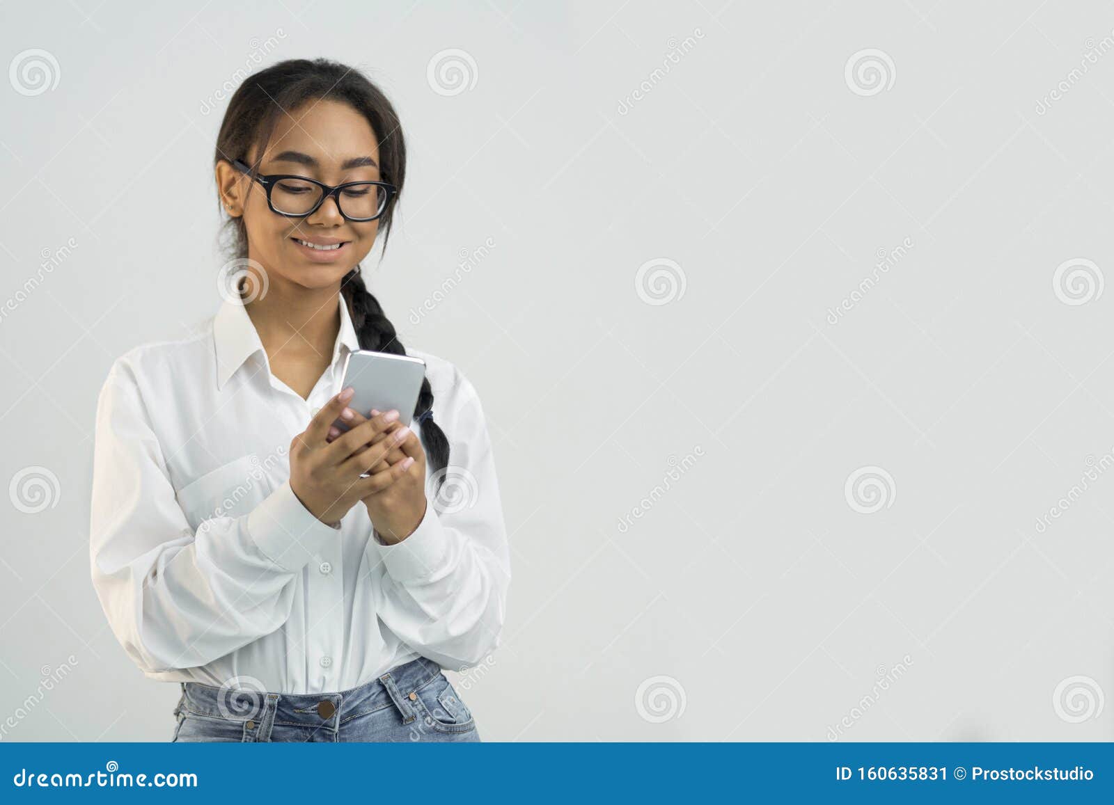 Cool Application. Student Girl Using Smartphone in Studio Stock Image ...