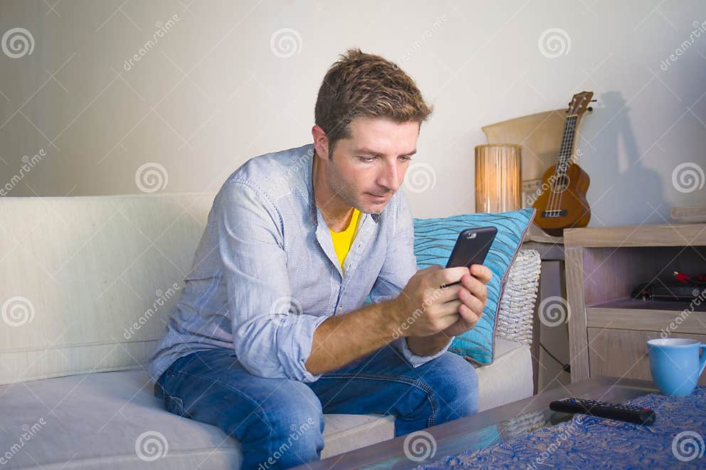 Cool Attractive And Happy Man Sitting At Living Room Sofa Couch