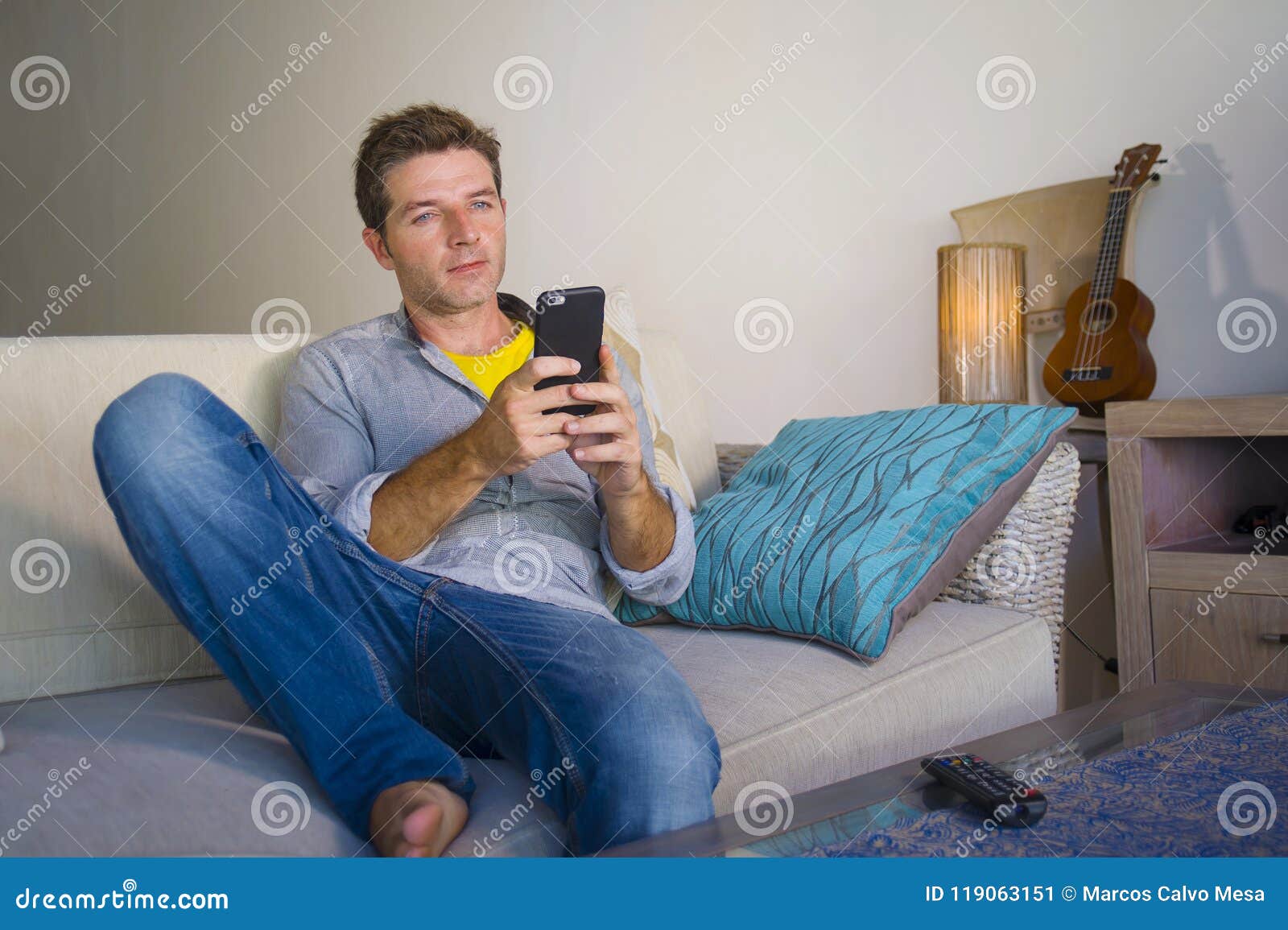 Cool Attractive And Happy Man Sitting At Living Room Sofa Couch