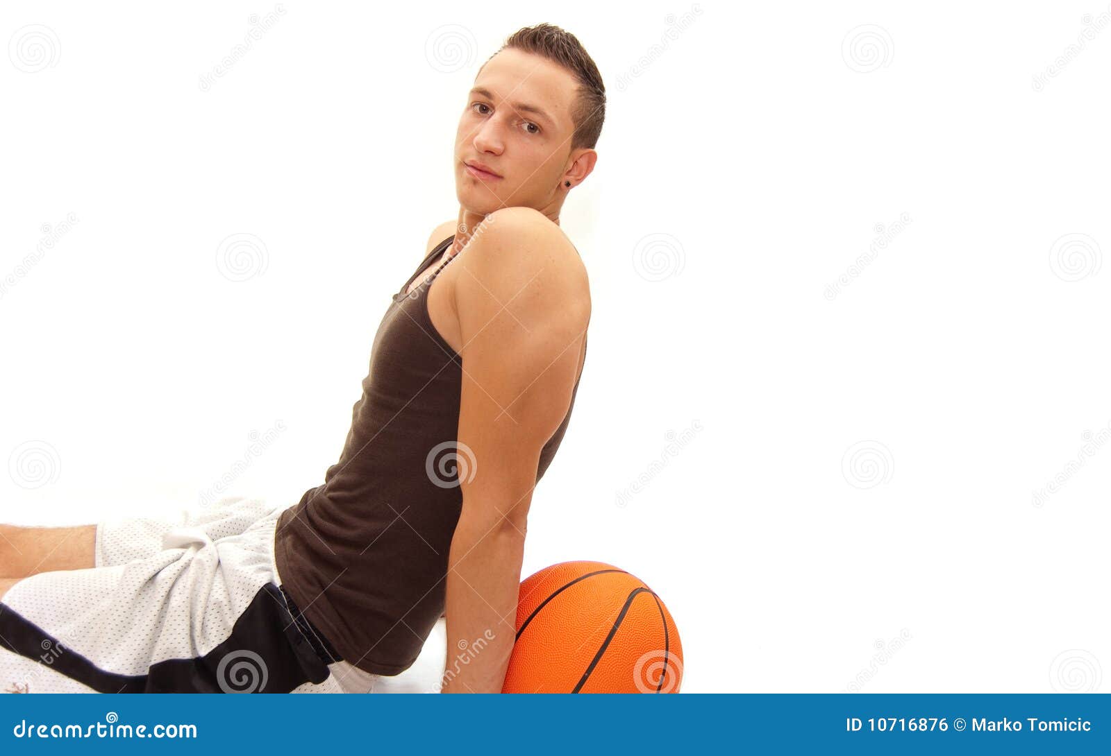 Cool Basketball Player Resting with Ball Stock Photo - Image of male ...