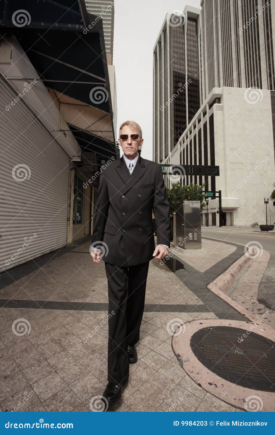 Cool businessman walking stock image. Image of businessman - 9984203
