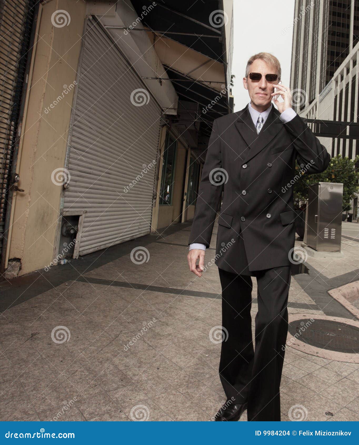 Cool Businessman Walking and Talking Stock Photo - Image of ...