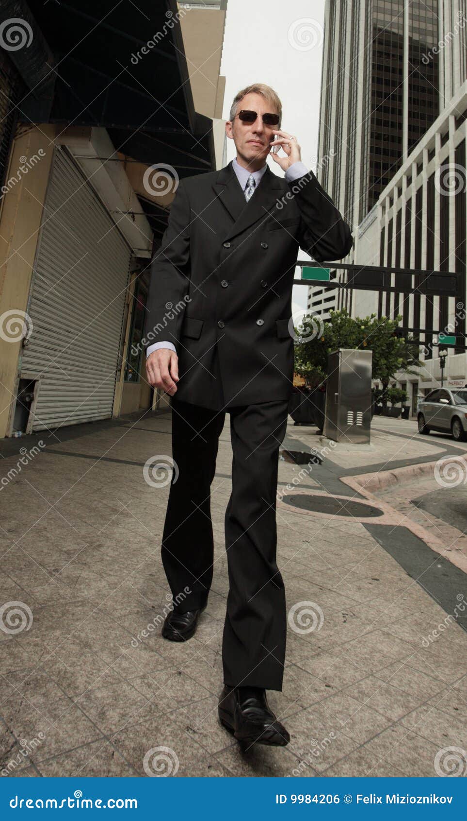 Cool Businessman Walking and Talking Stock Photo - Image of cell ...