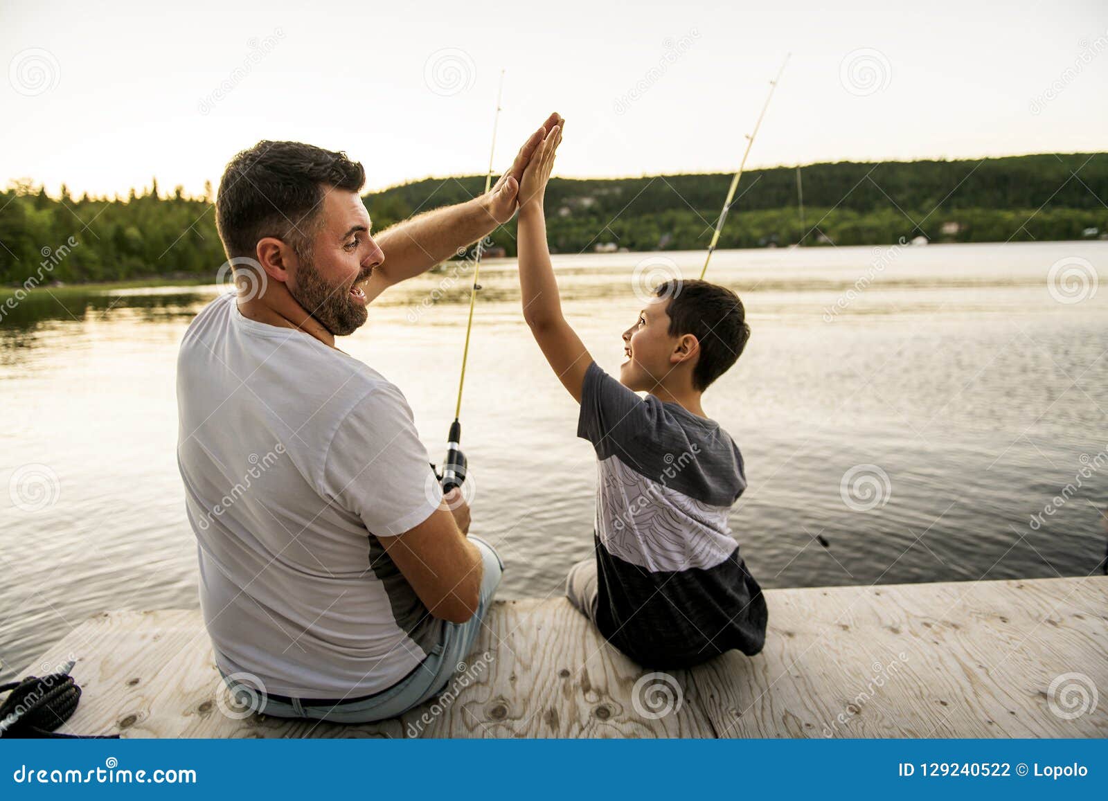 Cool Dad and Son Fishing on Lake Stock Photo - Image of catch, family ...