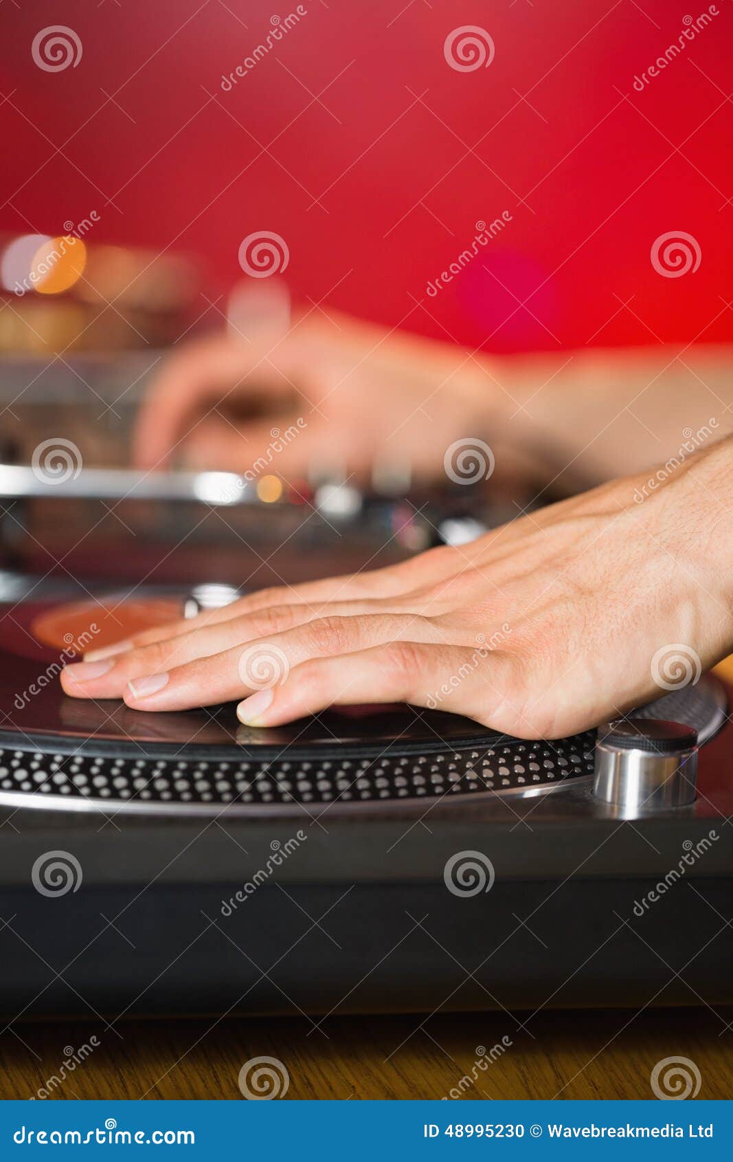 Cool dj spinning the decks stock photo. Image of side - 48995230
