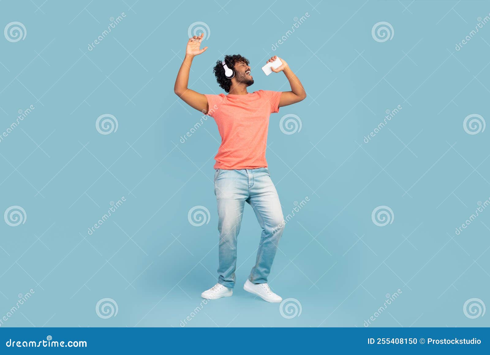 Cool Eastern Guy Singing and Dancing on Blue Stock Photo - Image of ...