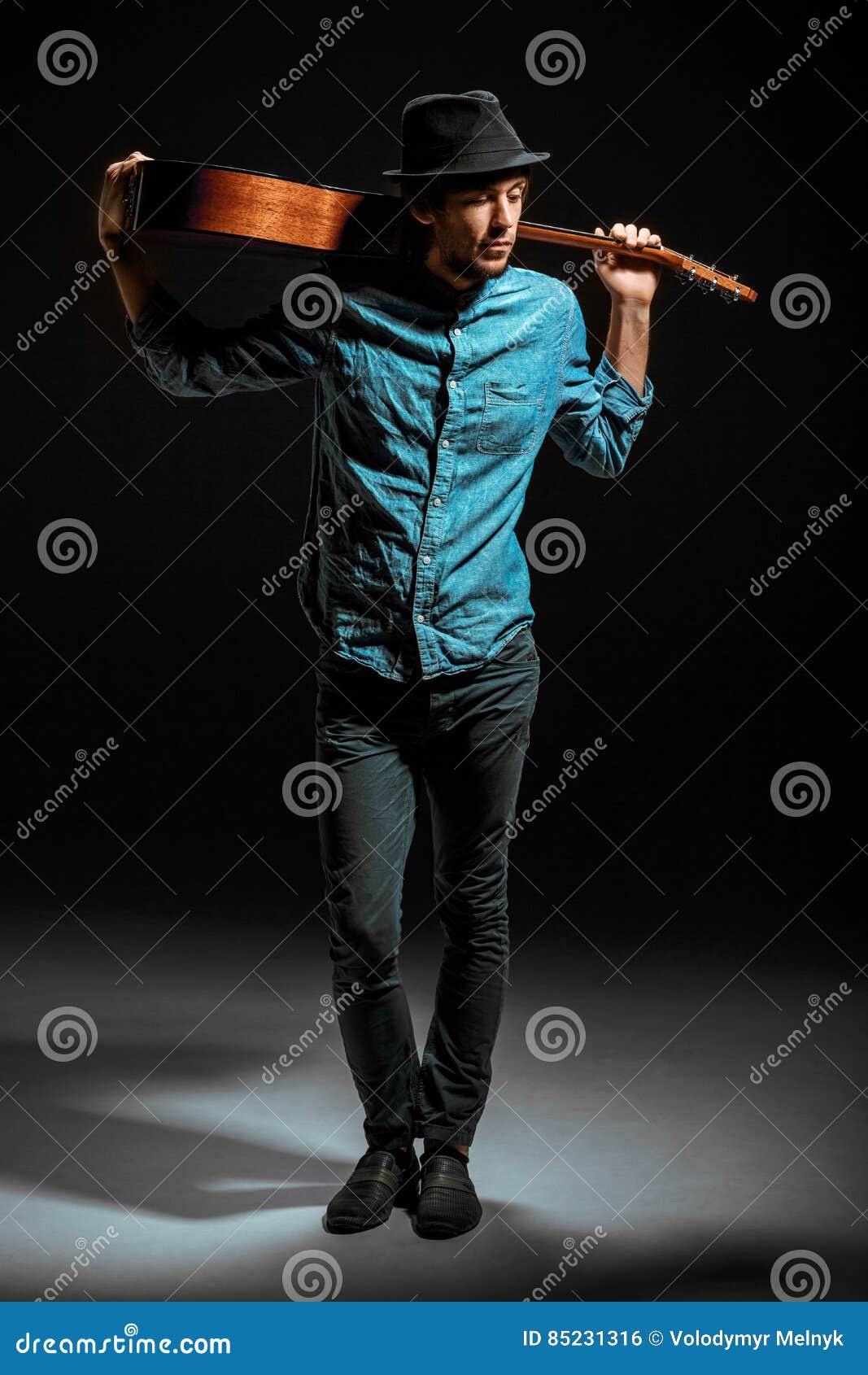 Cool Guy Standing with Guitar on Dark Background Stock Photo - Image of ...