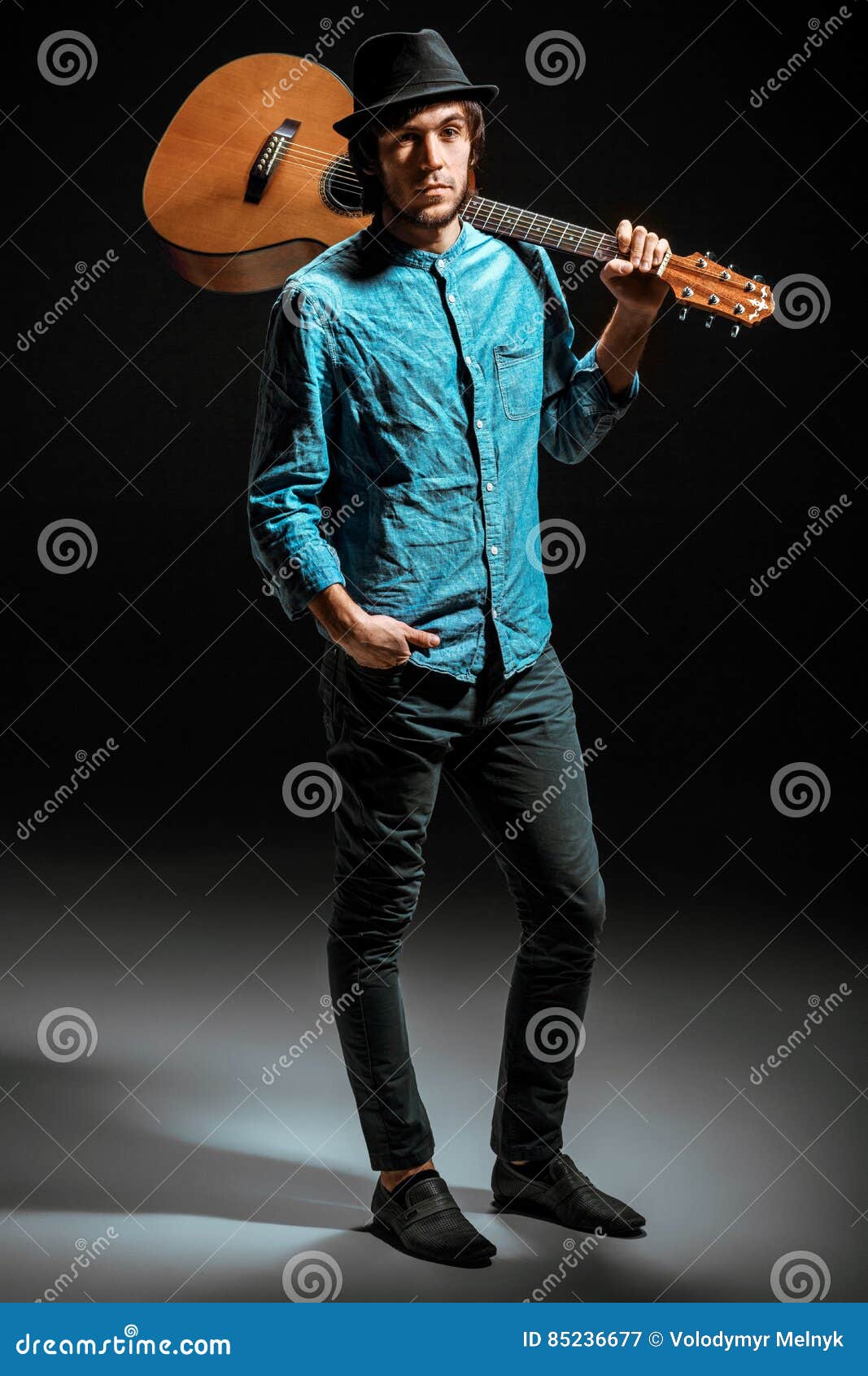 Cool Guy Standing with Guitar on Dark Background Stock Image - Image of ...