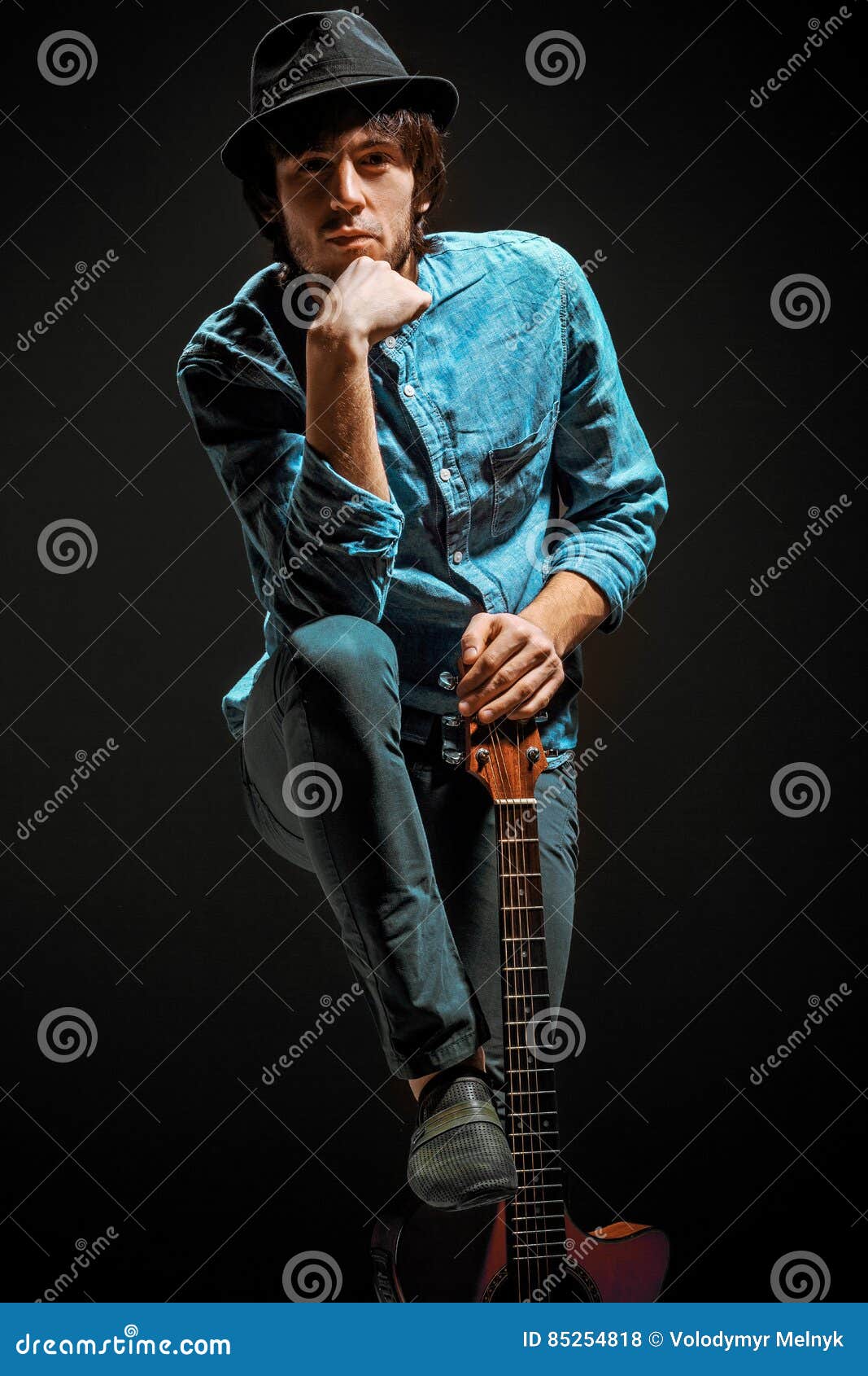 Cool Guy Standing with Guitar on Dark Background Stock Photo - Image of ...