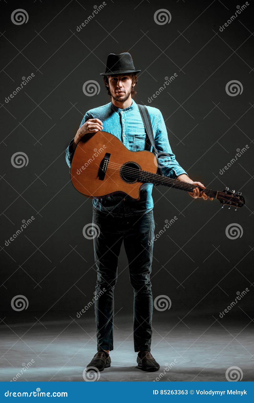 Cool Guy Standing with Guitar on Dark Background Stock Image - Image of ...