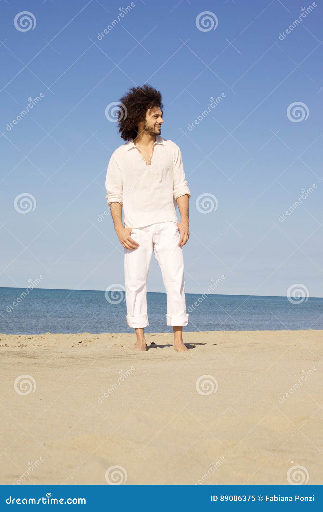 Cool Man Smiling Standing on Sand in Front of the Ocean Stock Image ...