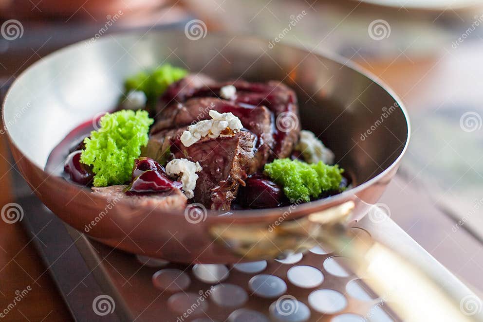Cool Meat in cherry sauce stock photo. Image of table - 94821610