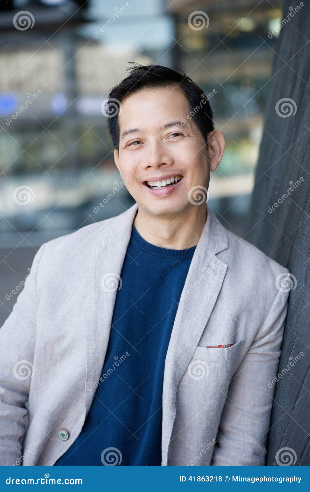 Cool Middle Aged Asian Man Smiling Stock Photo - Image of blue, aged ...