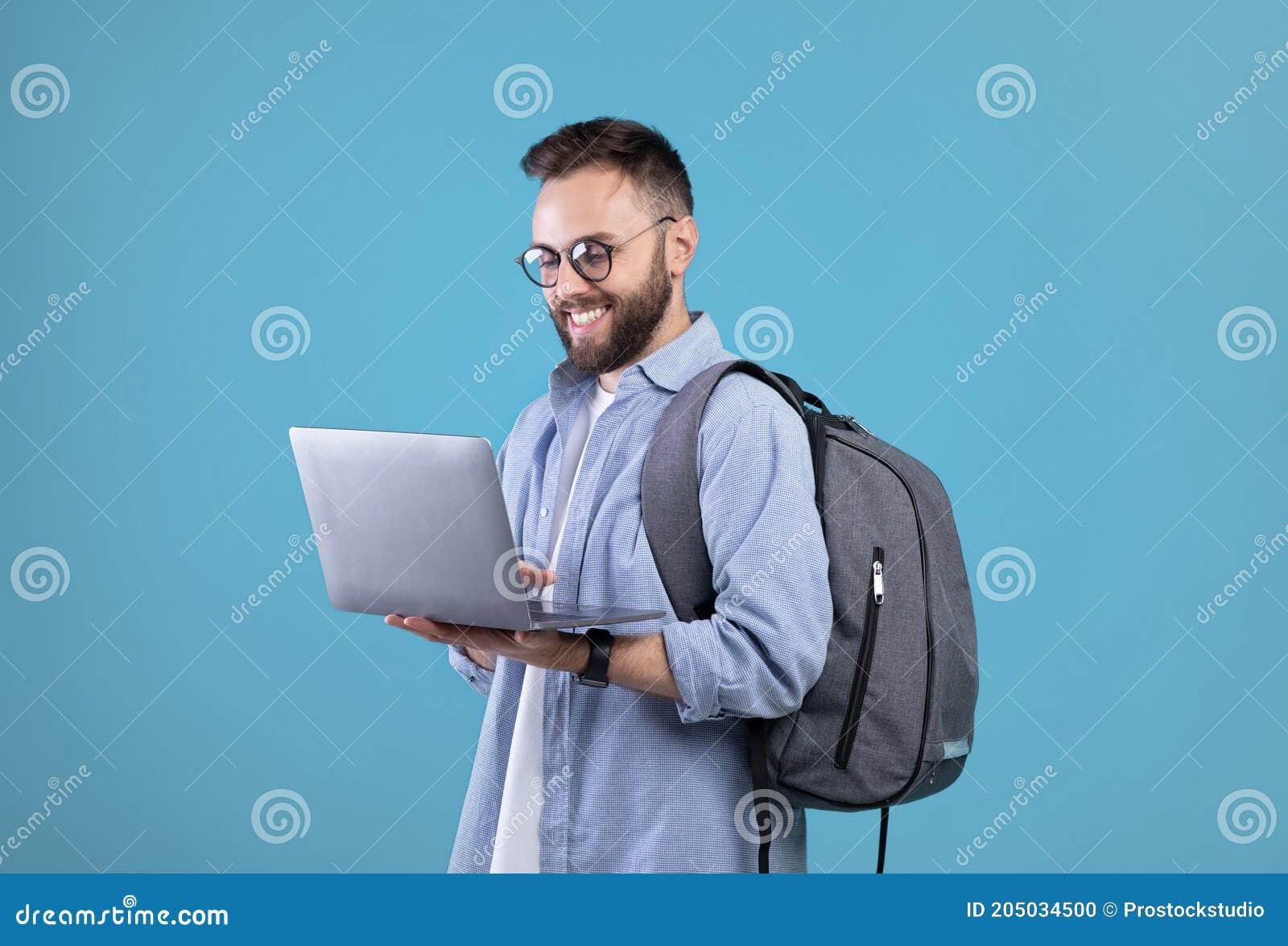 Cool Millennial Guy with Backpack Using Laptop for Online Work or ...