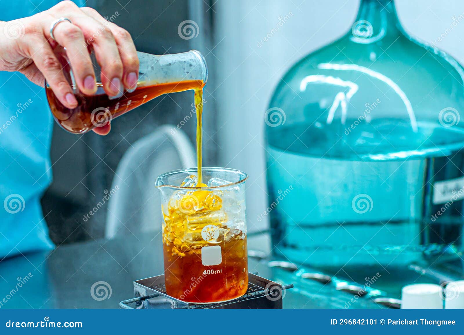 The Cool Mixologist: Bartender S Handcrafting Icy Drinks in Lab Beaker ...