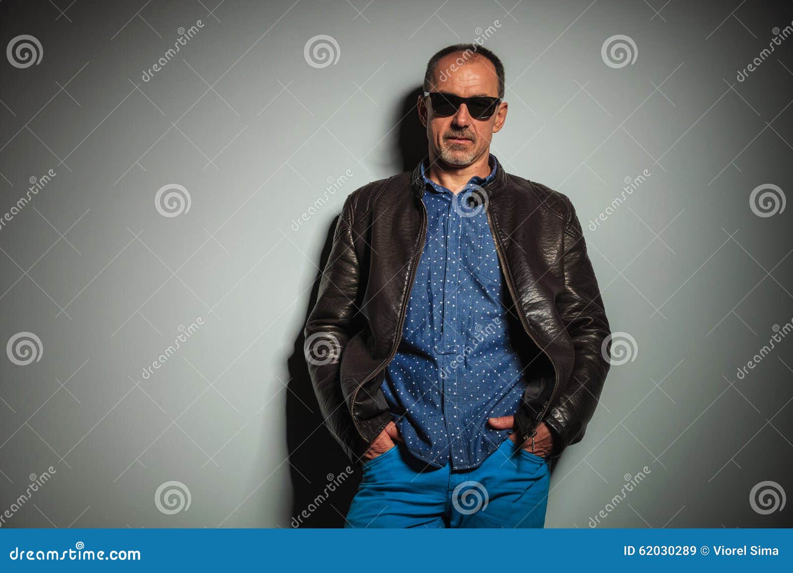Cool Old Casual Man Wearing Leather Jacket And Sunglasses Stock Image