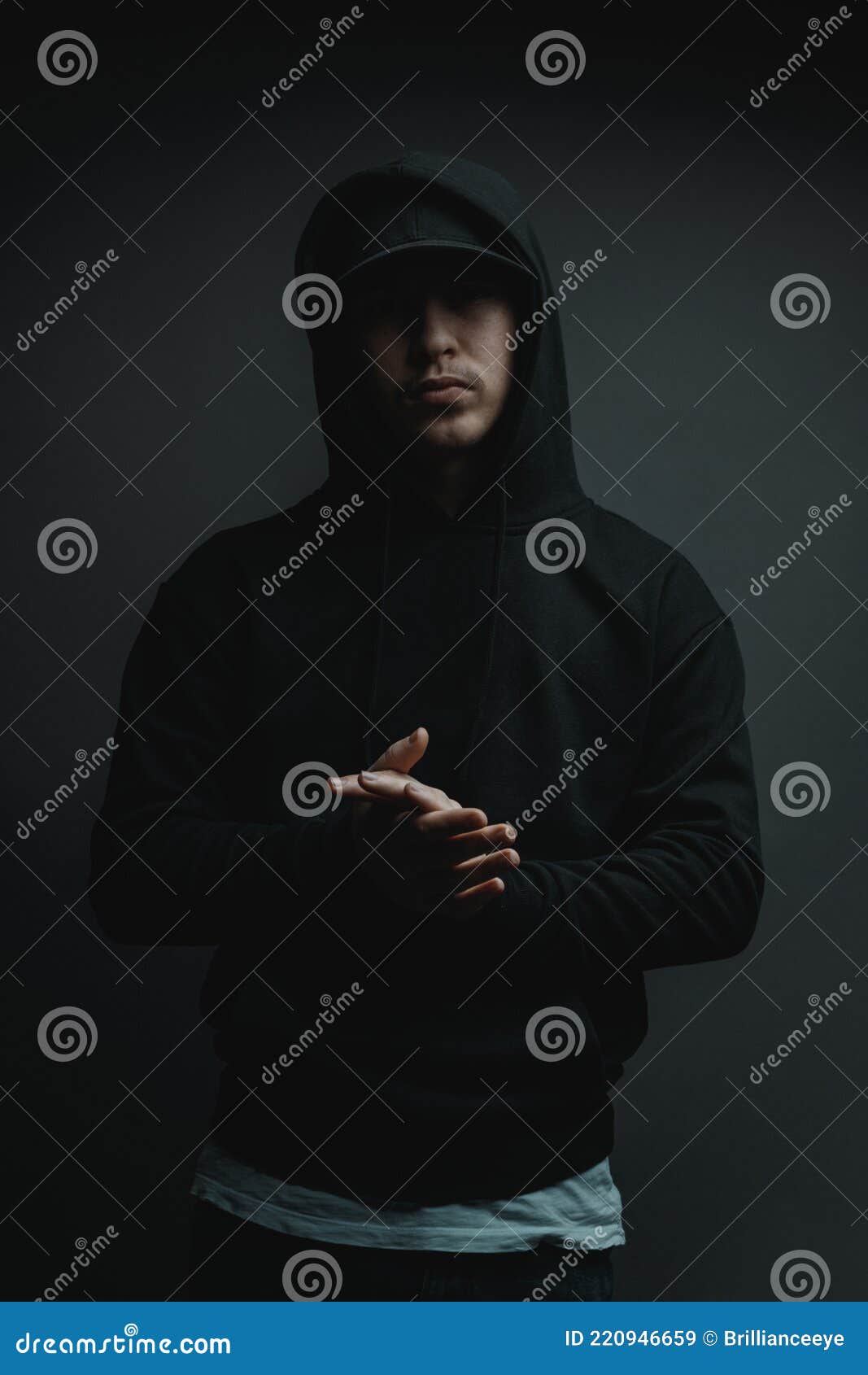 Cool Rapper with Black Hoodie and Cap Clapping His Hands in Front of ...