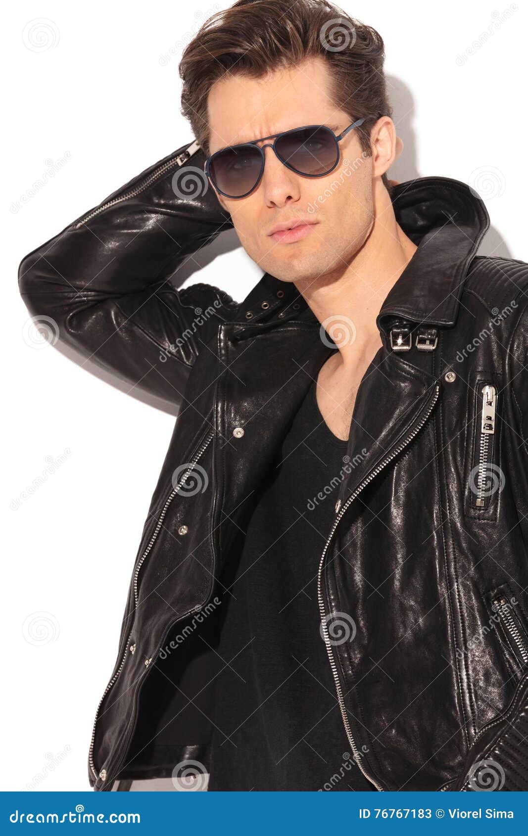 Cool Rocker in Leather Jacket Holding Hand Behind Head Stock Image ...