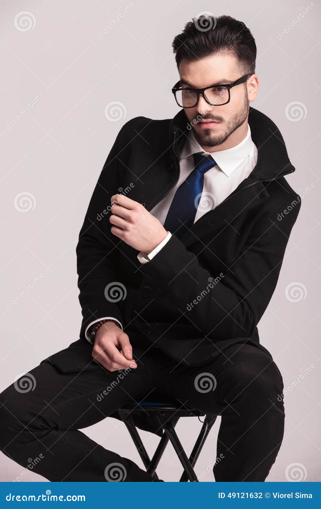 Cool Young Business Man Sitting on a Stool Stock Photo - Image of hold ...