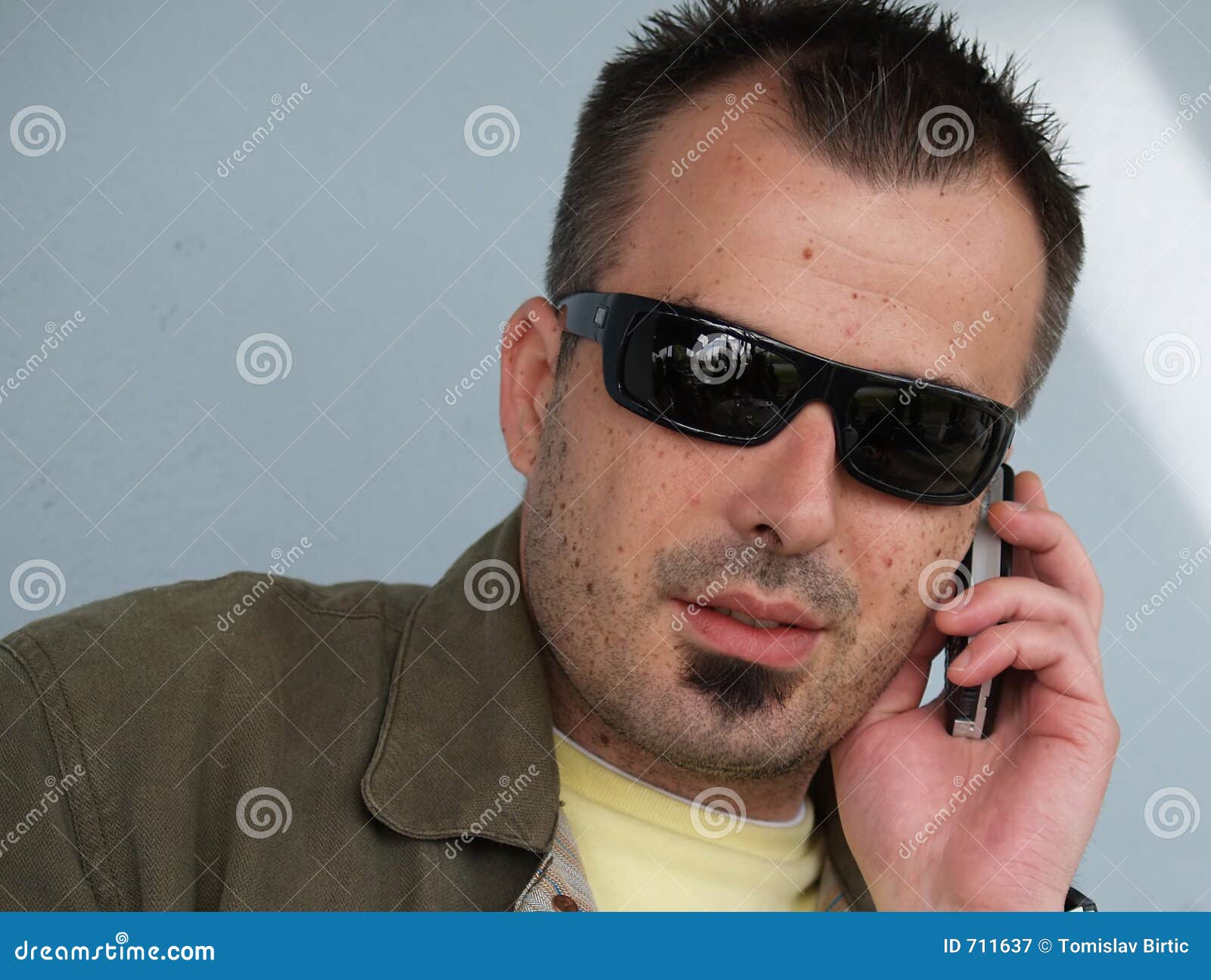 Cool Young Man Making a Phone Call Stock Image - Image of hair, blue ...