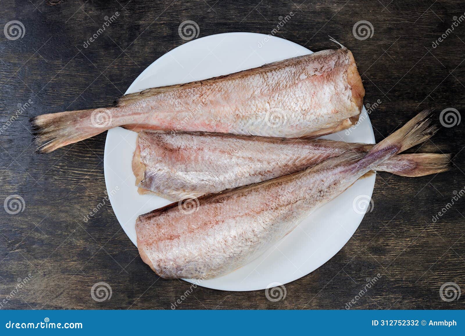 Cooled Carcasses of Red Cod on Dish on Black Surface Stock Photo ...