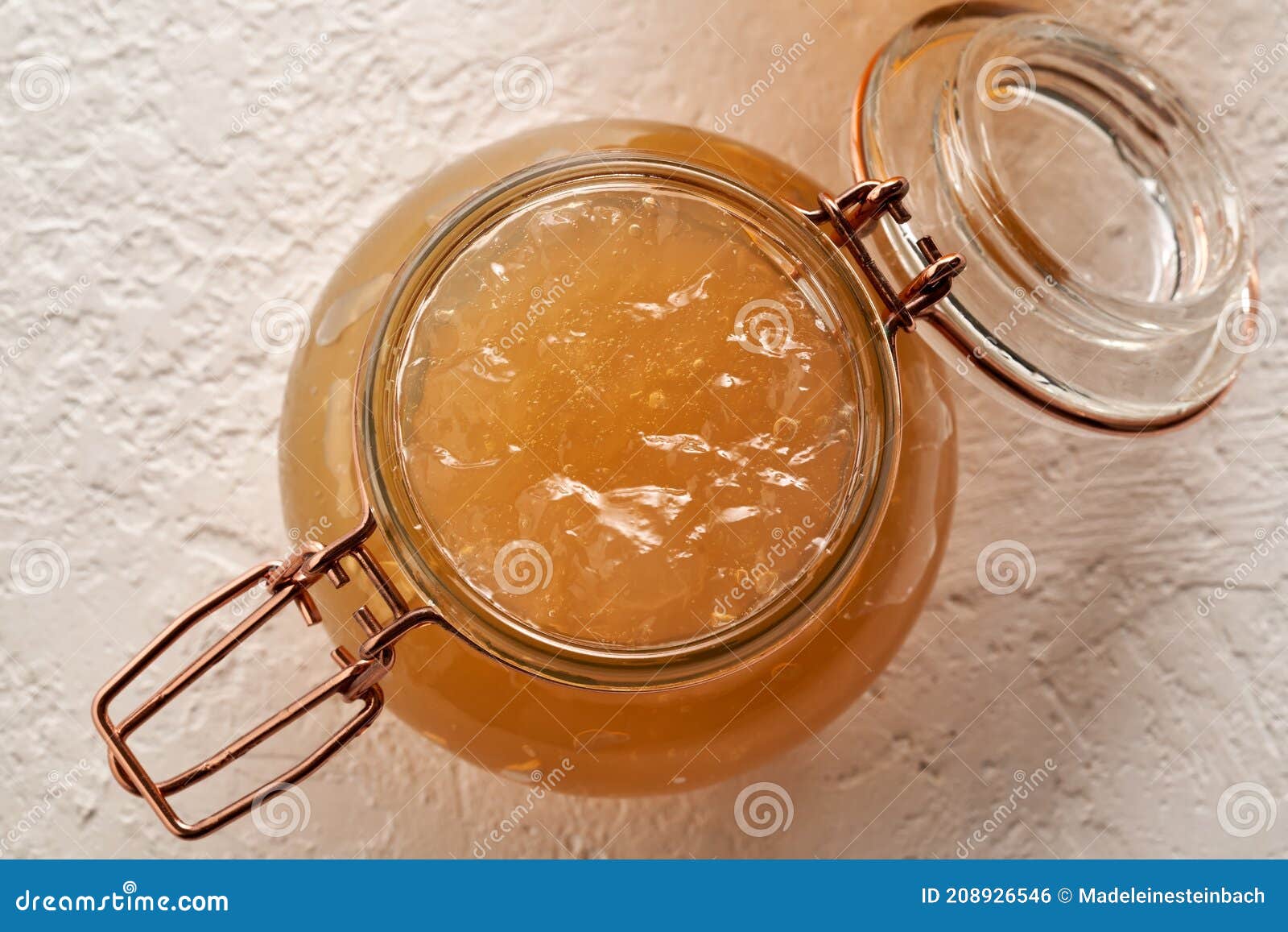 Cooled Down Congealed Beef Bone Broth in a Glass Jar on a Bright ...
