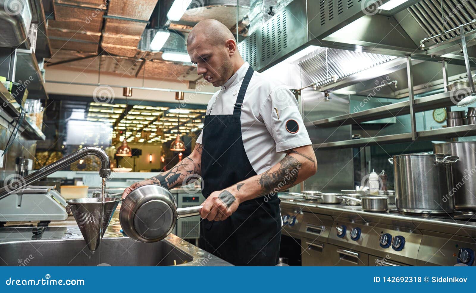 Cooling Down. Serious Professional Chef Holding Cooked Pasta in a ...