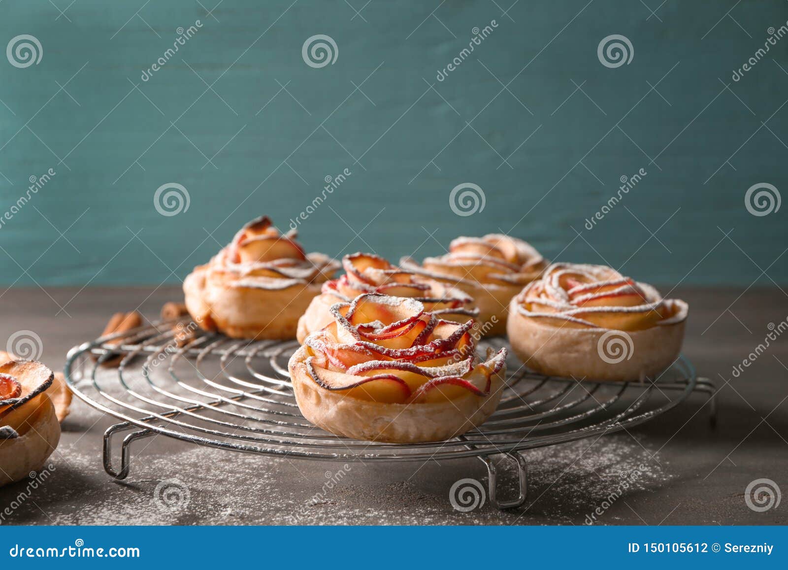 Cooling Rack with Rose Shaped Apple Pastry on Table Stock Photo - Image ...