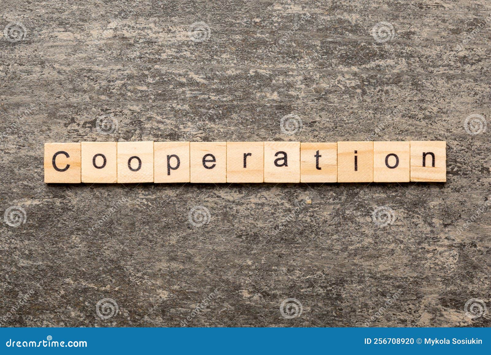 Cooperation Word Written on Wood Block. Cooperation Text on Table ...