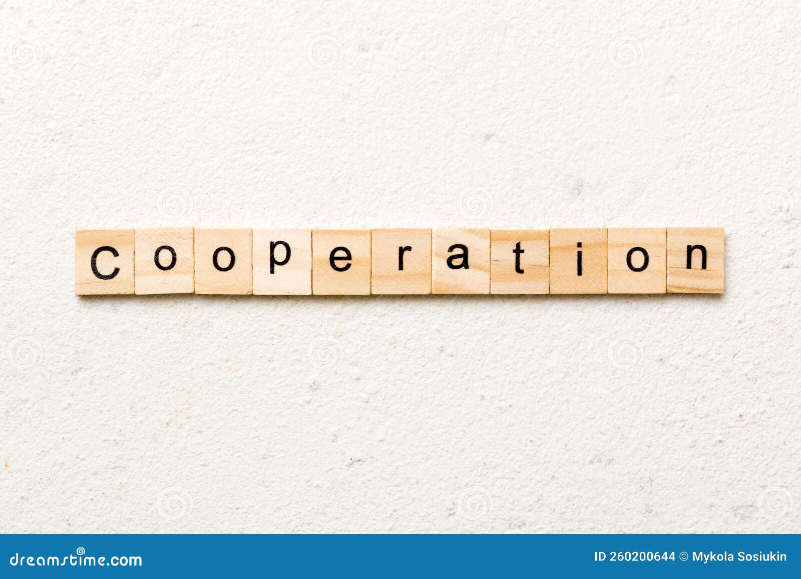 Cooperation Word Written on Wood Block. Cooperation Text on Table ...
