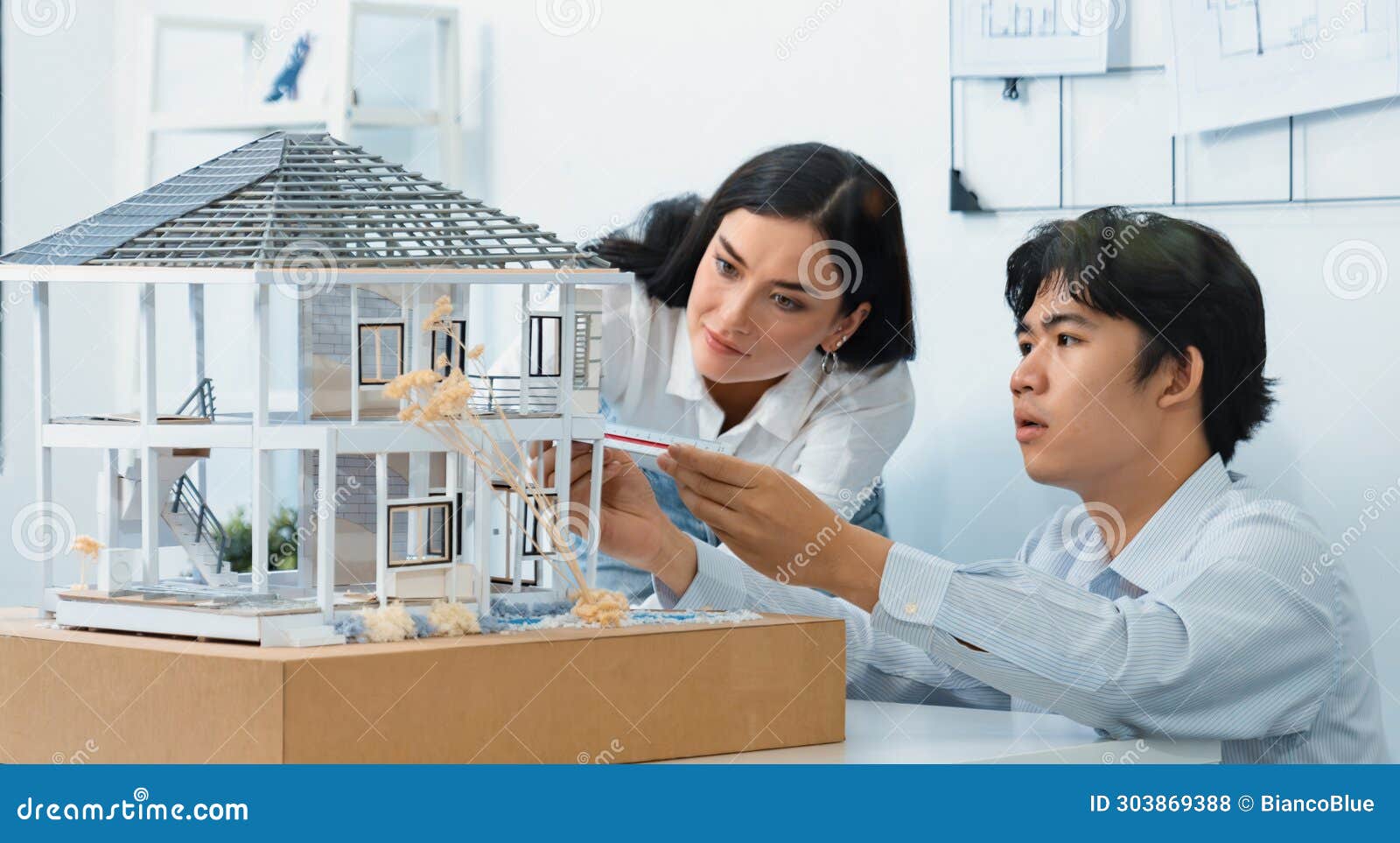 Cooperative Engineer Team Working Together To Measure House Model. Immaculate.. Stock Photo ...