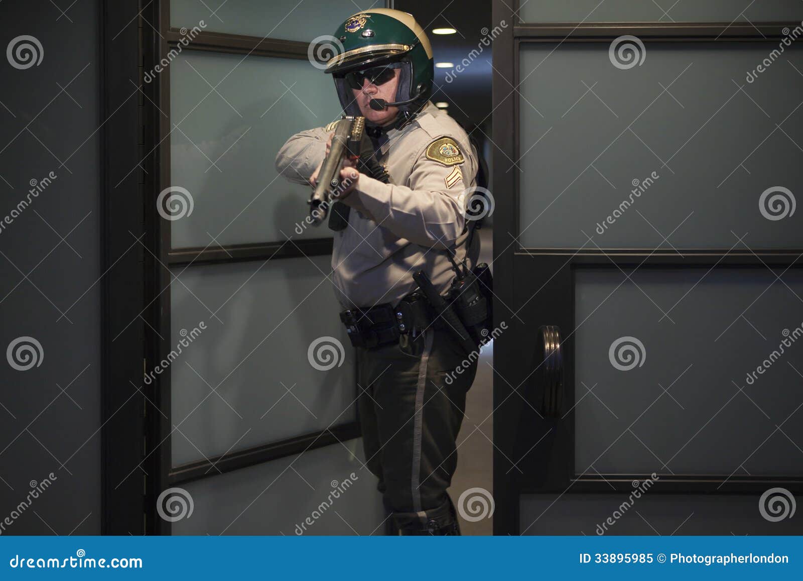 Cop Aiming Rifle while Standing at Door Stock Image - Image of ...