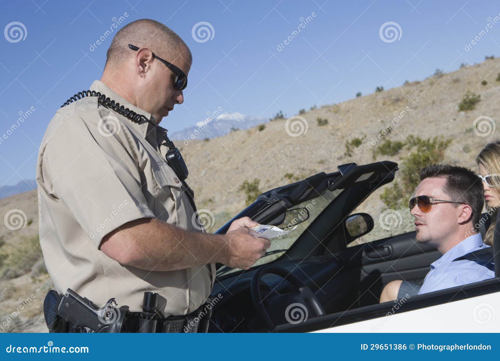 Cop Checking Man s License stock photo. Image of caught - 29651386