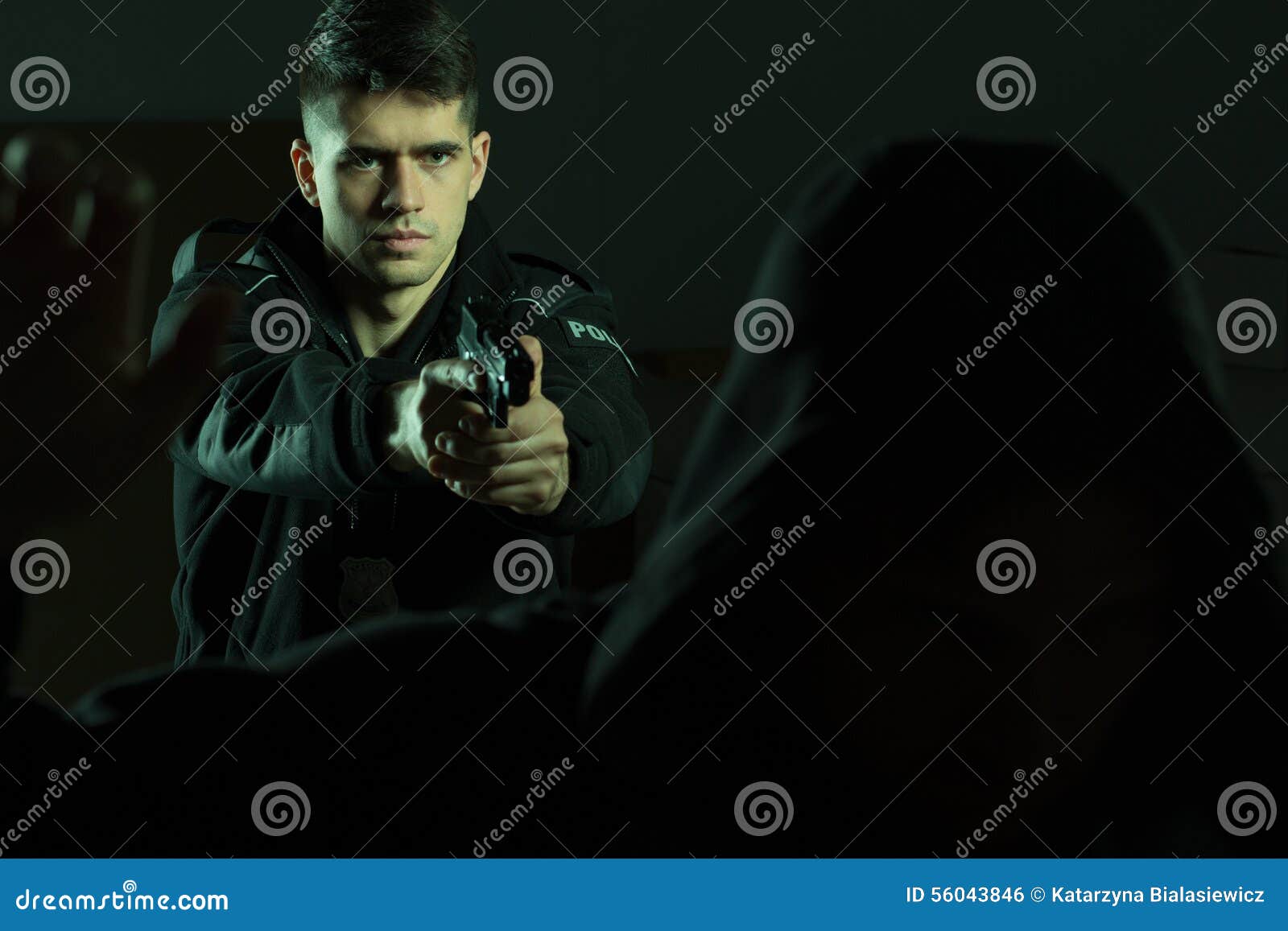 Cop pointing gun stock photo - polotsiam