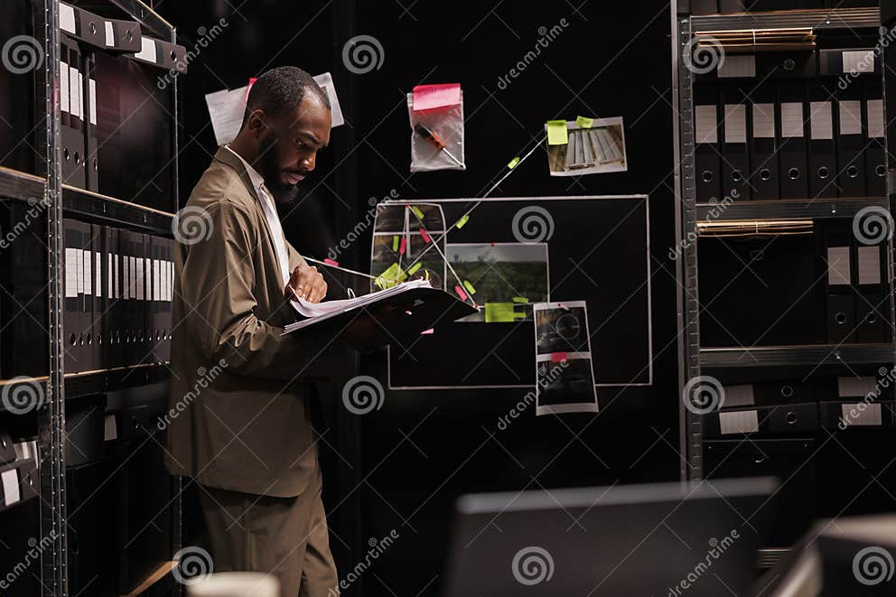 Cop Reading Case File and Studying Detective Board Stock Image - Image ...