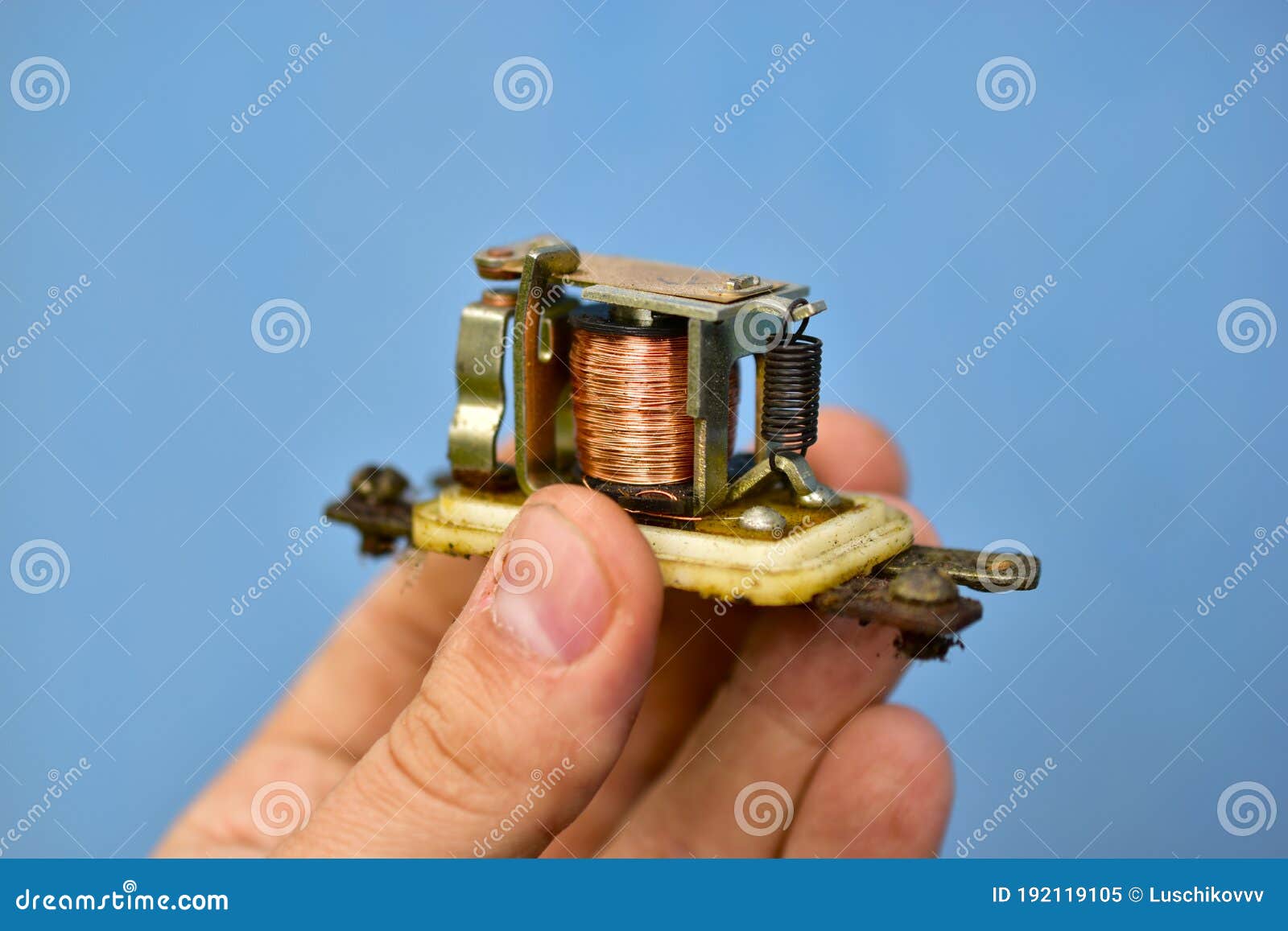 Copper Coil Switch in the Hands of a Master Stock Image - Image of ...