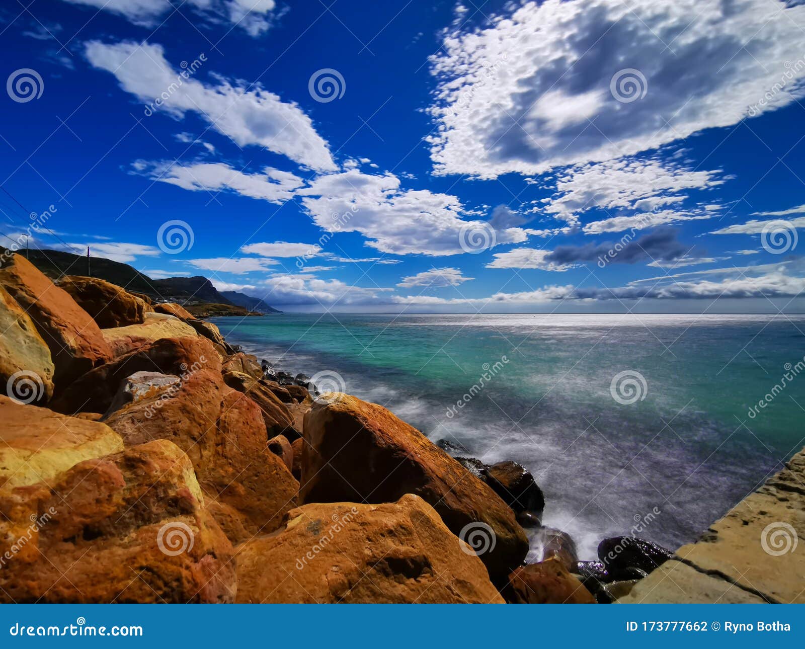 Copper Colored Rocks with Blue Sky Stock Photo - Image of coastline ...