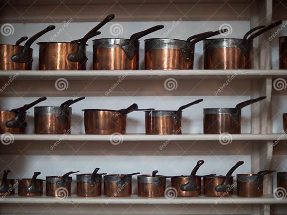 Copper Pots in Different Sizes on the Shelf. Stock Photo - Image of ...